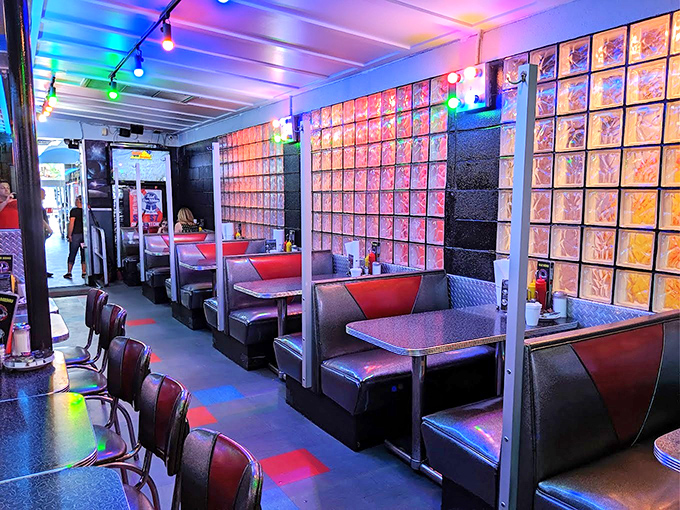 Step into this retro wonderland where neon lights and vinyl booths create pure diner magic.