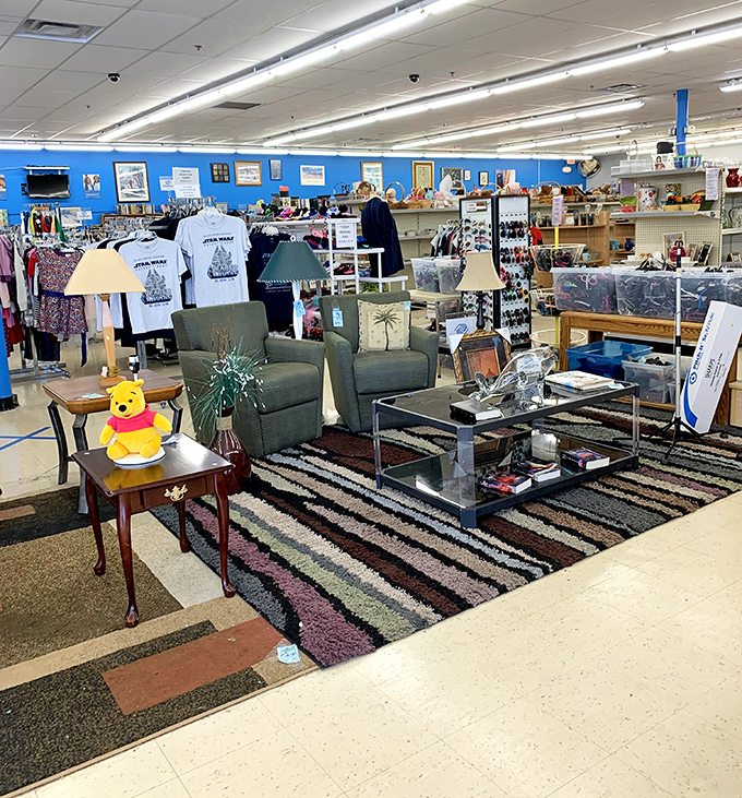 Blue walls frame this furniture vignette where Winnie the Pooh stands guard over potential living room makeovers waiting to happen.