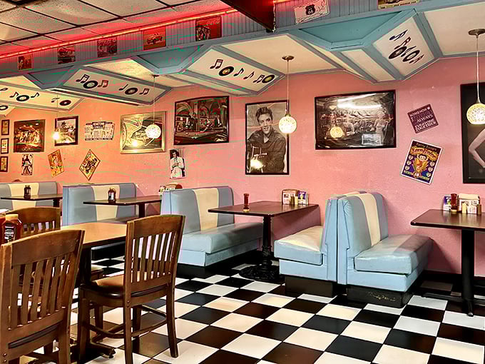 Step into a time capsule where pink walls meet blue vinyl booths, and every cultural icon from decades past watches over your breakfast adventures.
