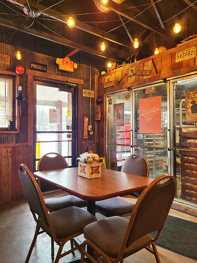 Edison bulbs cast a warm glow over vintage license plates and weathered wood, creating the perfect backdrop for meat-induced euphoria.