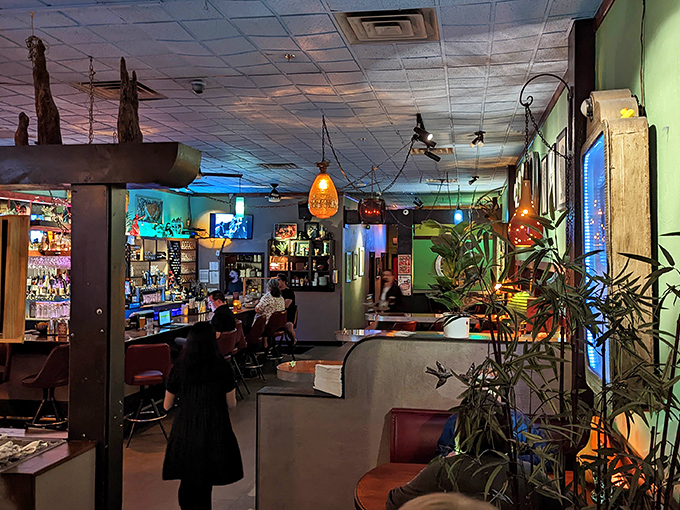 Step inside and the eclectic interior reveals itself &ndash; moody lighting, colorful walls, and enough plants to qualify as a small ecosystem.