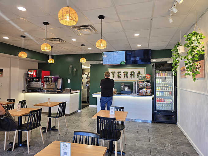 Modern minimalism meets sandwich artistry in Terra's dining room, where woven pendant lights cast a glow worthy of the food below.