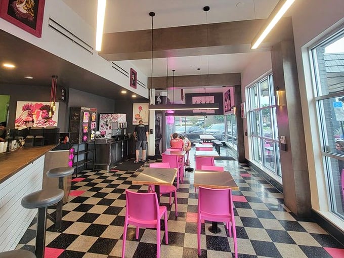 Step inside and the retro-modern vibe hits you immediately &ndash; black and white checkerboard floors meet hot pink chairs in a space that screams "Instagram me, but eat the chicken first!"