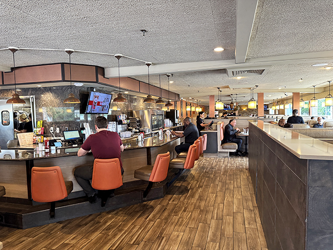 Where orange leather stools and warm wood floors create the perfect backdrop for breakfast magic.