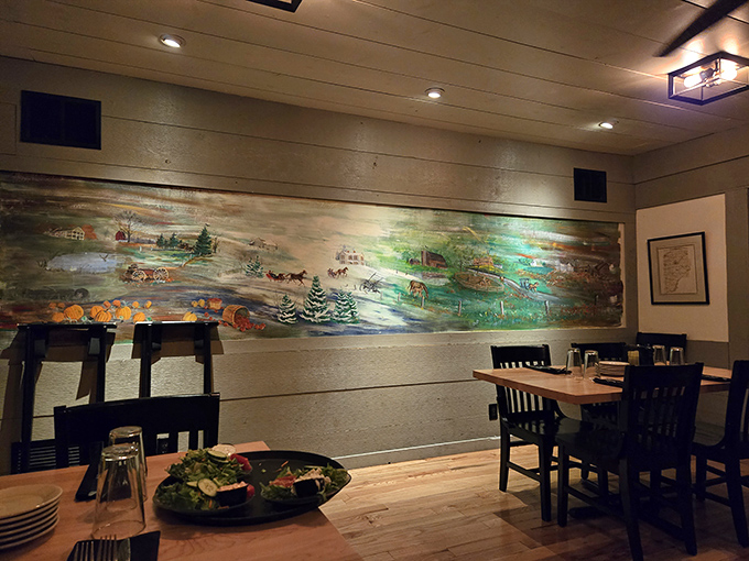 The pastoral mural stretching across the dining room wall tells a story of Midwestern heritage&mdash;a perfect backdrop for the feast to come.