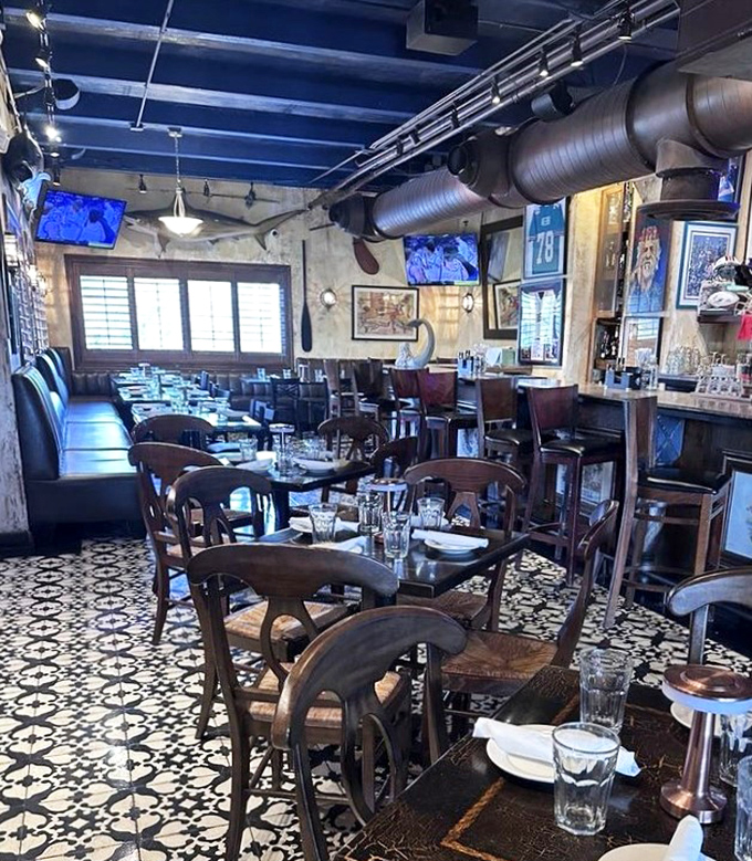 Inside, wooden chairs, patterned tile floors, and exposed ductwork create that perfect "discovered gem" atmosphere that makes you feel like a culinary explorer.