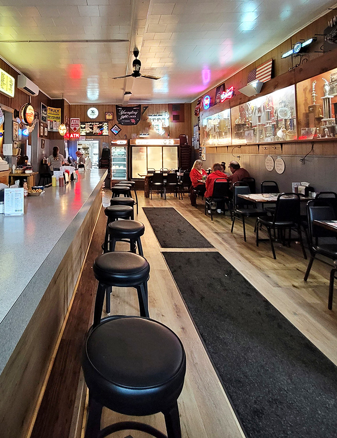 Step inside and time stands still. Wood paneling, neon signs, and counter seating create the perfect backdrop for food memories in the making.