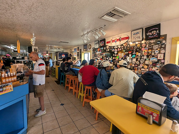 Inside, colorful stools and walls plastered with memorabilia tell stories of decades of satisfied seafood pilgrims. History you can sit on!