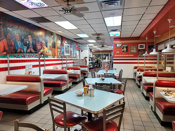 Classic red vinyl booths and checkerboard tiles create the perfect time capsule where conversations flow as freely as the coffee.