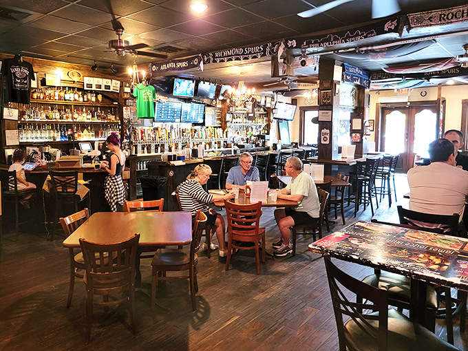 Inside, dark wood furnishings and memorabilia create that authentic pub atmosphere where conversations flow as freely as the Guinness.