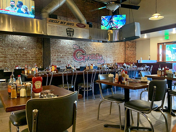 Inside, the exposed brick walls and bustling atmosphere create the perfect backdrop for breakfast theater. Every table tells a story of impending food comas.