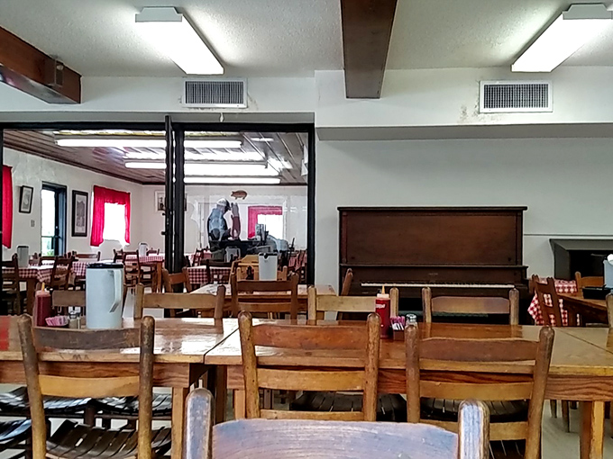 Simple wooden tables and red-checkered tablecloths set the stage for a no-frills feast where the food does all the talking.