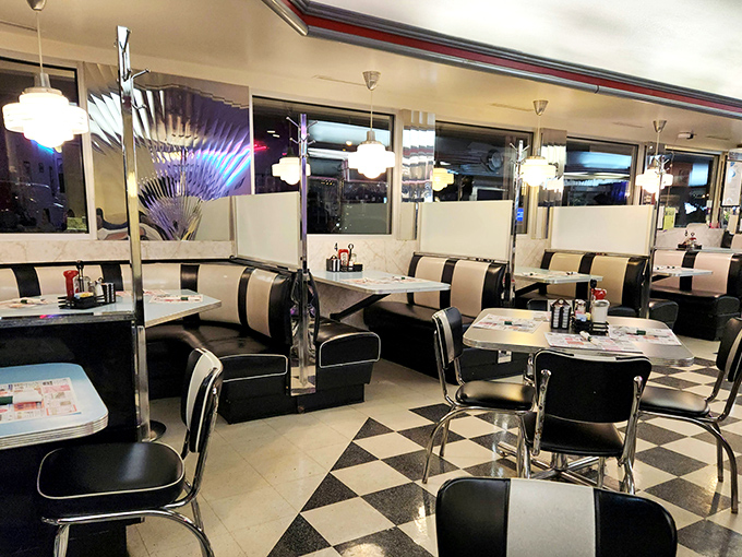 Black and white never looked so inviting. These vinyl booths have witnessed first dates, family celebrations, and countless "I shouldn't, but I will" dessert decisions.