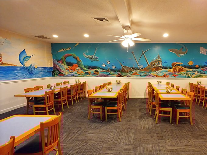 Ocean murals transform dining into an underwater adventure without the hassle of getting wet. Those wooden chairs have witnessed countless "best meal ever" declarations.
