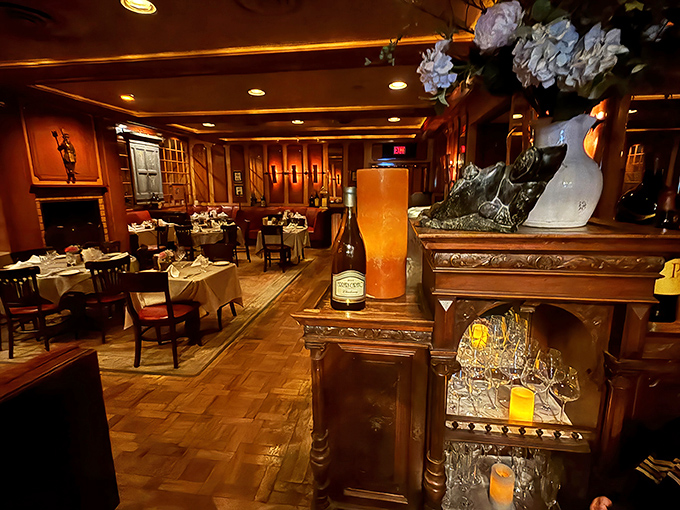 Rich wood paneling, warm lighting, and white tablecloths create the perfect old-school atmosphere for serious meat consumption – no filters or influencers required.