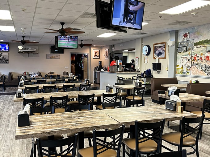 Simple wooden tables await the delicious chaos of a proper Maryland crab feast, where newspaper-covered surfaces soon become battlegrounds of delectable destruction.