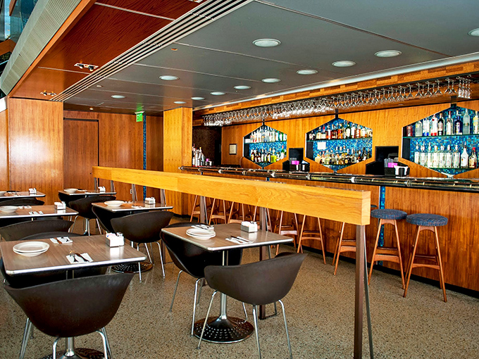 Mid-century modern meets James Bond's living room in this wood-paneled bar area where martinis practically mix themselves.