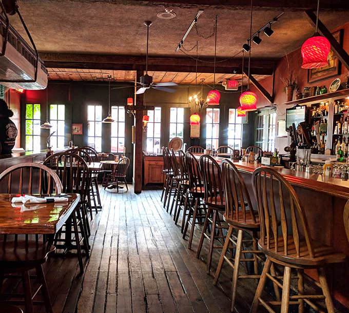 Wooden floors that have witnessed thousands of memorable meals, Windsor chairs, and those distinctive pink pendant lights create an atmosphere that's both rustic and refined.