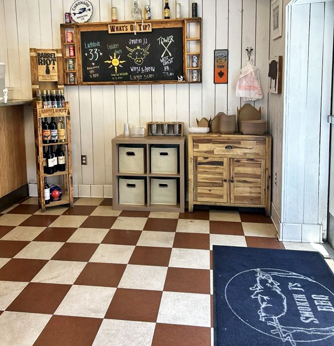 Checkerboard floors and rustic wooden walls set the stage for meat magic. This no-frills interior says, "We're serious about barbecue, not interior design."