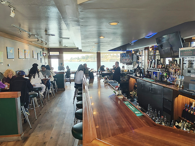 Where locals congregate at the gleaming wooden bar, swapping fishing tales while the Pacific provides a backdrop worthy of a postcard.