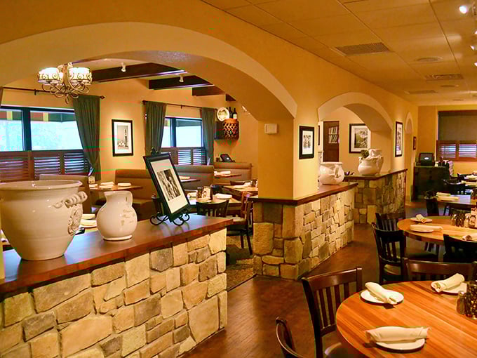 The warm, inviting entrance welcomes diners with its rustic stone and wood elements, promising authentic Italian comfort ahead.