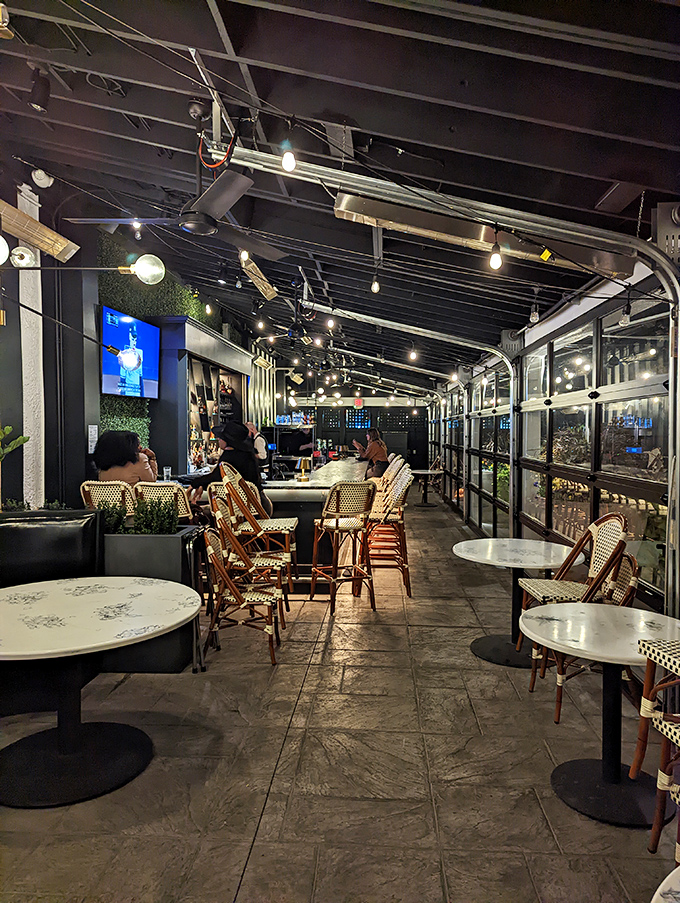 The elegant bar area invites lingering conversations over perfectly mixed cocktails, where every seat feels like the best in the house.