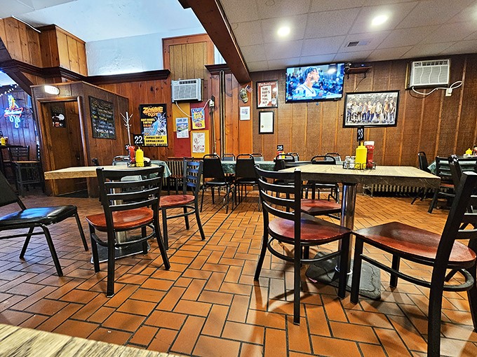 Wood-paneled walls and terra cotta floors create the kind of unpretentious dining room where comfort trumps trendiness and conversations flow as freely as the gravy.
