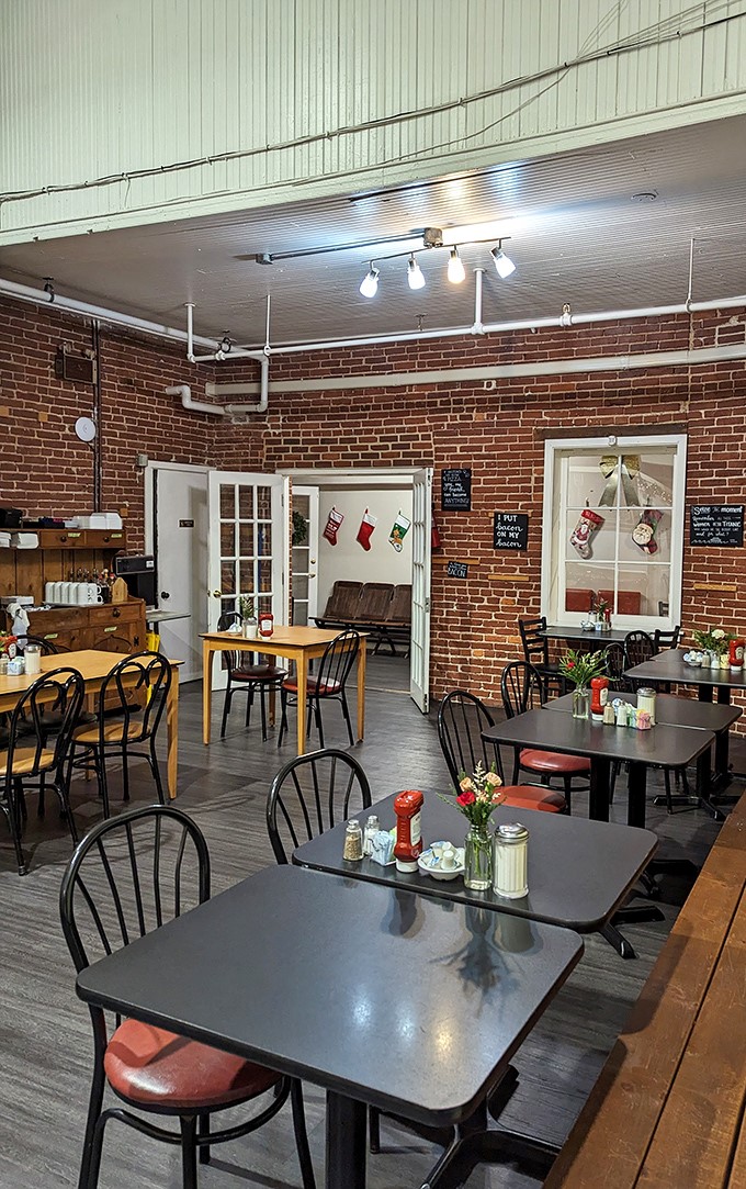 Exposed brick walls and simple wooden tables create that rare atmosphere where you instantly feel like a regular, even on your first visit.