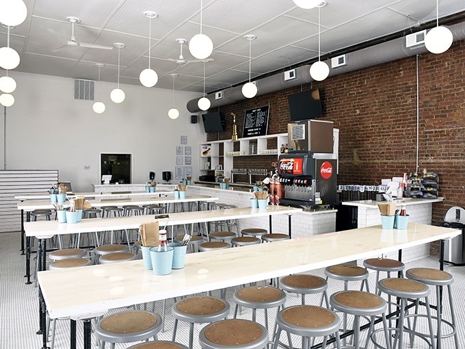 Clean lines, communal tables, and that exposed brick wall&mdash;a temple of simplicity where the chicken, not the decor, does the talking.