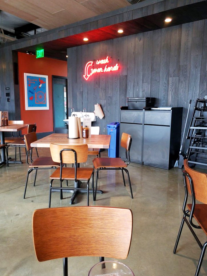 Industrial chic meets Texas roadhouse inside ZZQ. That "Craft Smoked" neon isn't just decoration—it's a solemn promise.