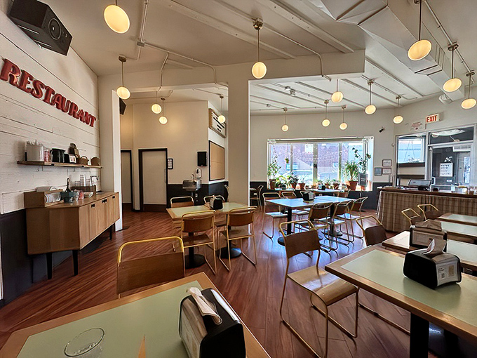 Sunlight streams through large windows, illuminating a dining room that feels both modern and homey&mdash;like your coolest friend's kitchen.