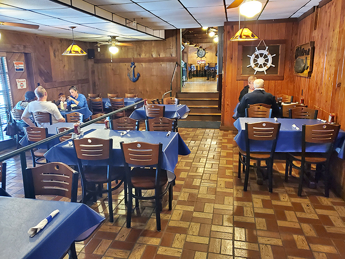 Nautical nostalgia meets dining comfort inside, where ship wheels and wooden paneling transport you to a seaside cabin without the seasickness.