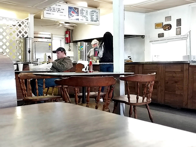 Inside B's, wooden chairs and simple tables create the perfect stage for Eastern NC's barbecue drama. The real luxury here is what's on your plate, not what's on the walls.