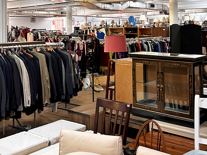 Racks upon racks of possibility! The men's suit section alone could outfit an entire law firm, while furniture waits patiently for its second act.