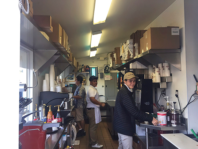 Behind the scenes magic happens in this compact kitchen where staff orchestrates a delicious symphony of burgers, shakes, and coastal comfort food.