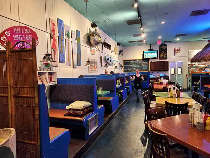 Coastal casual meets burger joint perfection with blue booths, local art, and a "take a book, share a book" shelf for literary appetites.