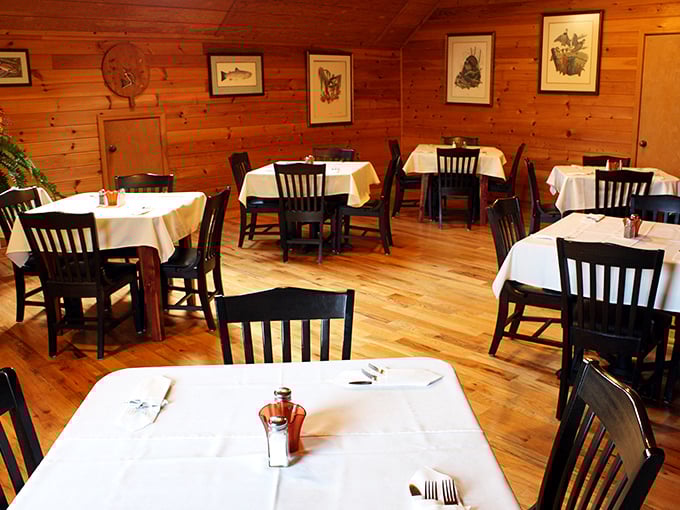 White tablecloths meet knotty pine walls in this dining room where conversations flow as smoothly as the gravy on your mashed potatoes.