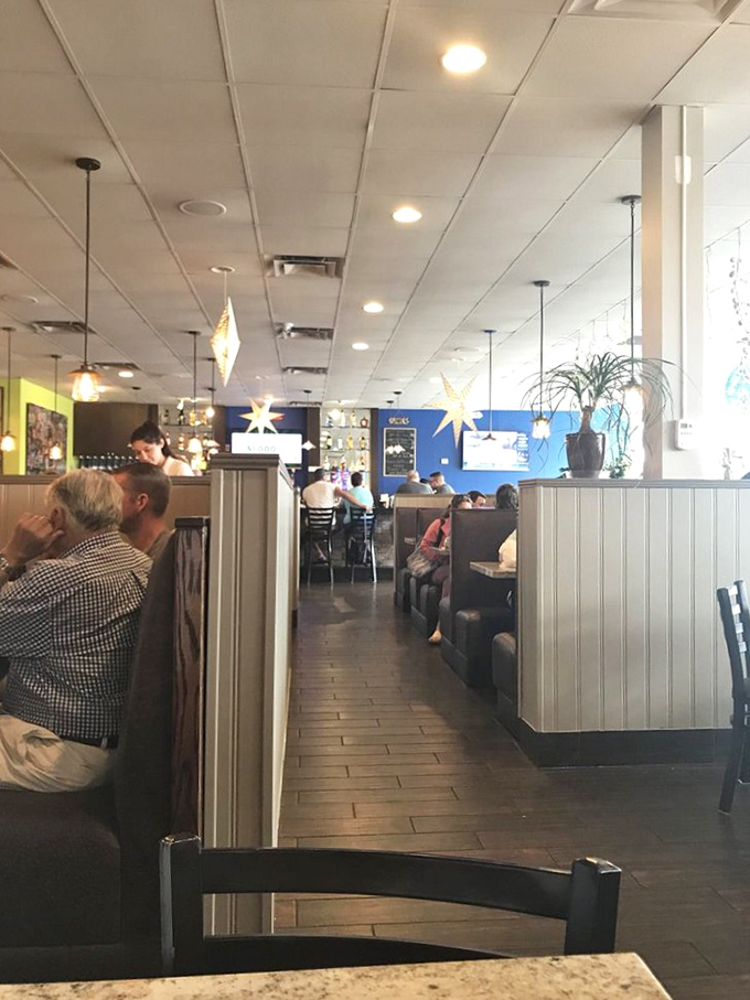 Inside, the cozy dining room buzzes with conversation and clinking silverware – the symphony of a successful neighborhood eatery in full swing.