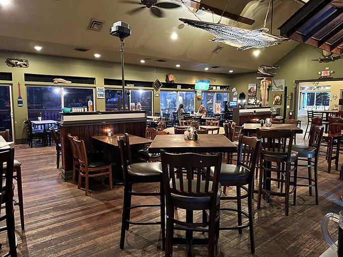 Inside, rustic wooden tables and a suspended fish sculpture create that perfect "I've discovered something special" atmosphere that makes memorable dining experiences.