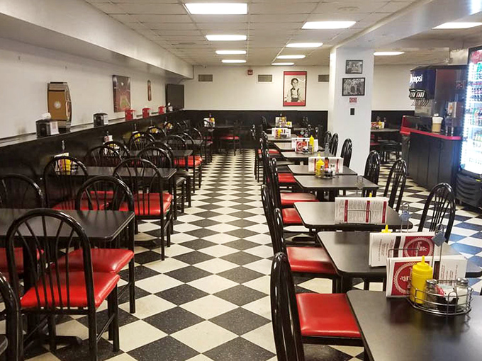 Classic black and white checkerboard floors set the stage for deli magic, where red vinyl seats have cradled countless satisfied customers through the years.