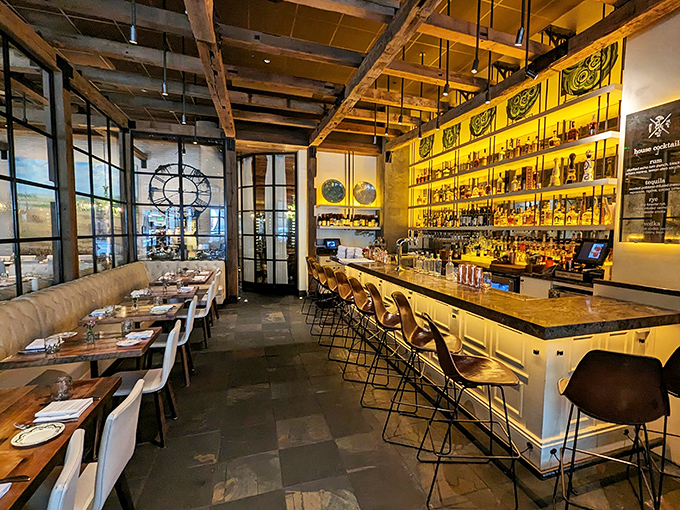 Rustic meets refined in this stunning interior where exposed beams hover above a gleaming bar. It's farmhouse chic that whispers, "Stay awhile."