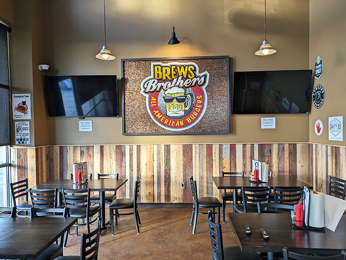Rustic wood paneling meets modern comfort inside Brews Brothers, where every table promises a front-row seat to flavor town.