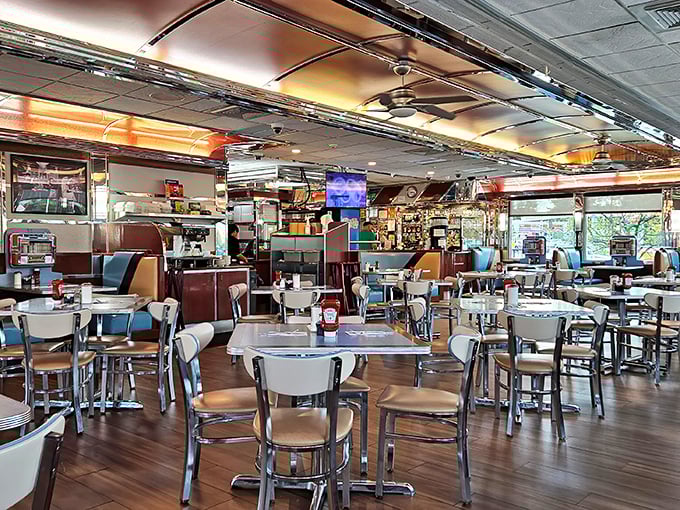 Classic diner geometry: chrome meets vinyl in a space where conversations flow as freely as the coffee, and everyone feels like a regular.