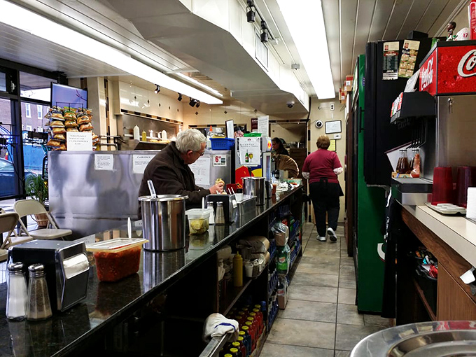Inside Dalessandro's, the narrow counter setup is a masterclass in efficiency. Every inch dedicated to the art of sandwich-making.