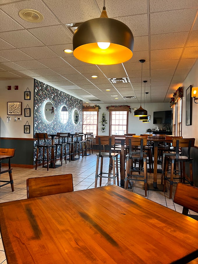 Modern pendant lighting and that statement floral wall create an atmosphere that's both Instagram-worthy and genuinely comfortable—a rare combination indeed.