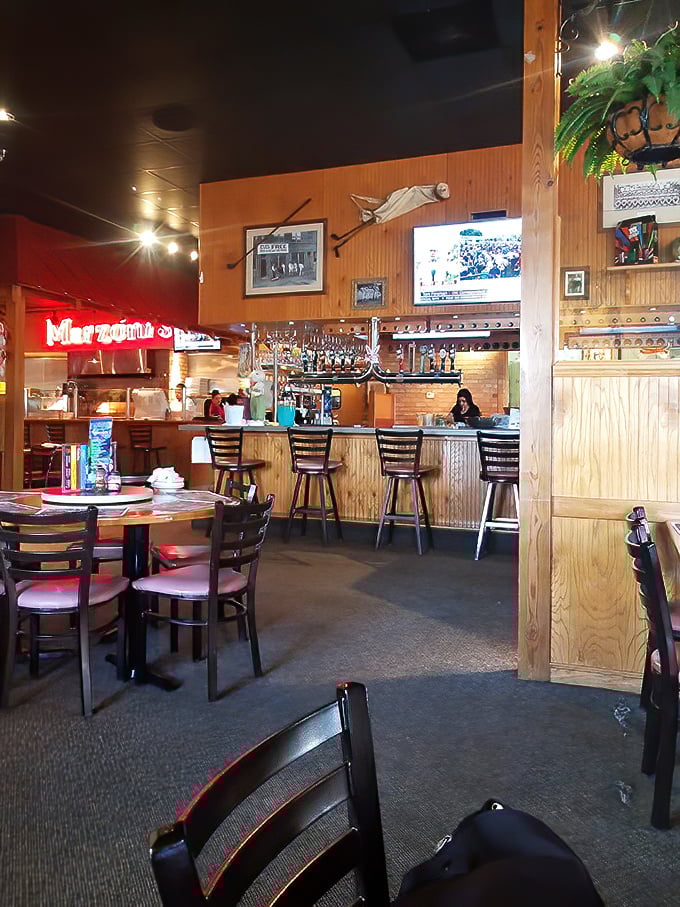 The warm wooden interior strikes that perfect balance between "neighborhood favorite" and "worth the drive." Where beer meets brick oven and culinary magic happens.