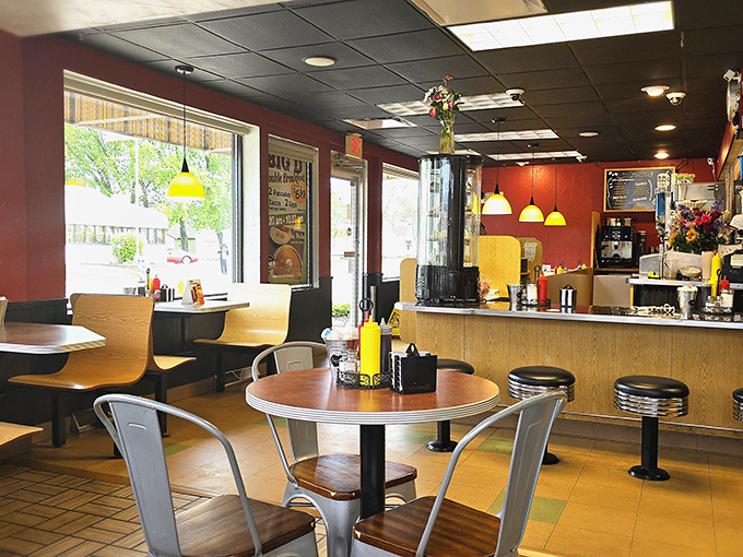 Warm burgundy walls and pendant lighting create the perfect backdrop for morning revelations. This is where breakfast dreams come true.