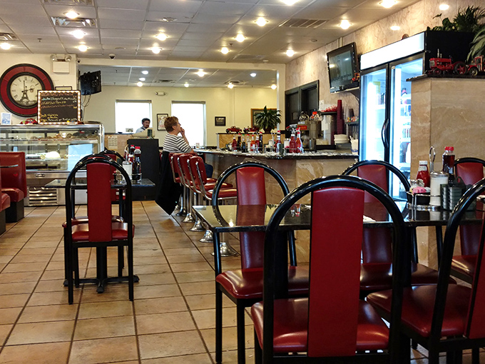 Classic red vinyl chairs and gleaming countertops &ndash; the universal language of "sit down and stay awhile."
