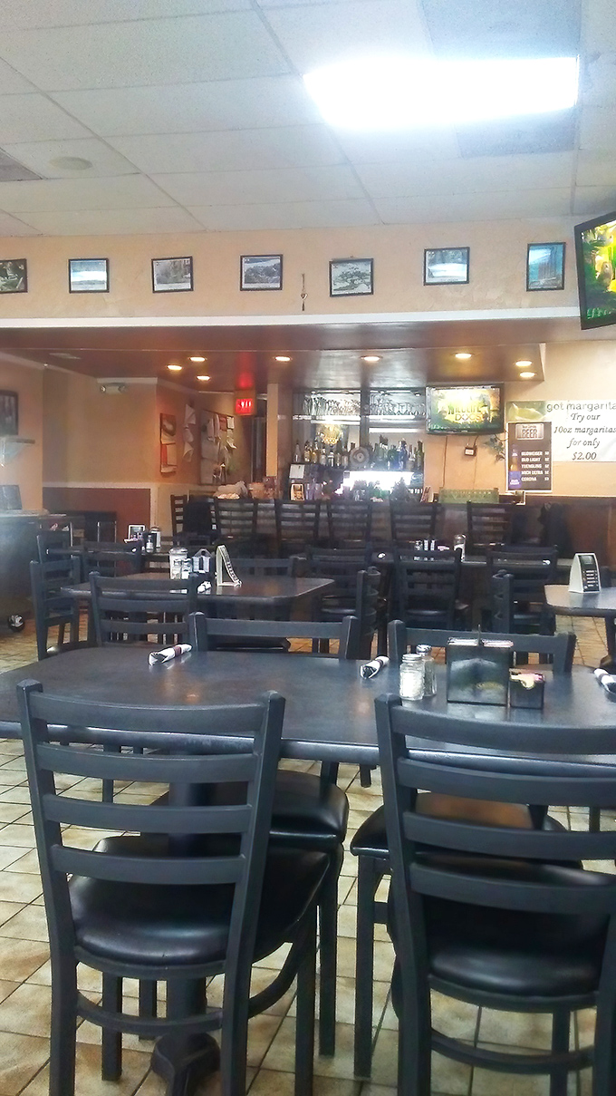 Dark wood chairs, tiled floors, and the promise of comfort food. This isn't interior design; it's a visual guarantee of satisfaction.