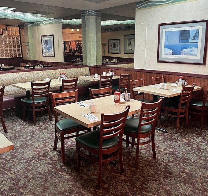 The warm wood paneling and comfortable booths create that perfect "welcome home" vibe, where calories don't count and coffee refills are practically mandatory.